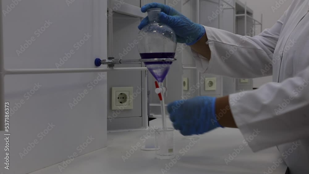 Separating funnel laboratory glassware used in liquid-liquid ...