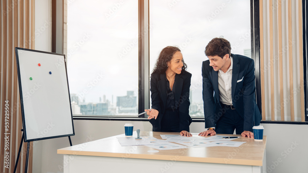 Successful businesspeople working together in a co-working office Stock ...