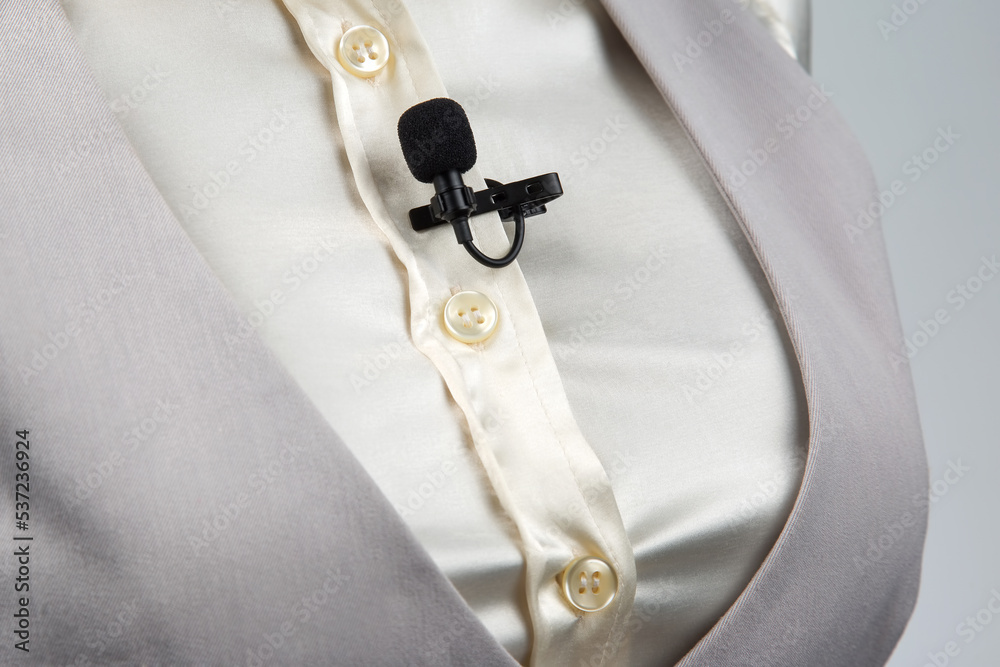 small microphone on a clothespin for voice recording is attached to a ...