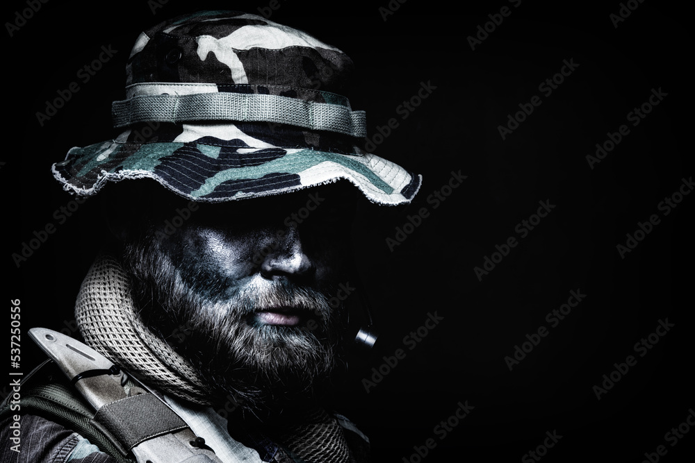 Foto de Close up, low key portrait of bearded commando fighter, army ...