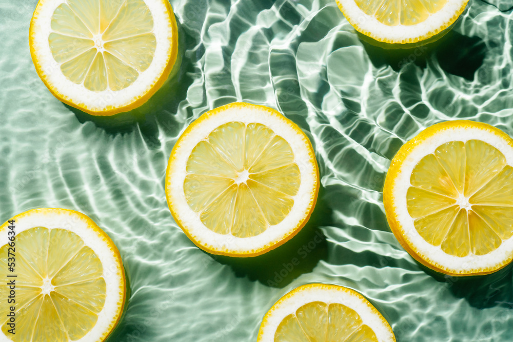 Transparent fresh exhilarant wave water with flecks background, lemon ...