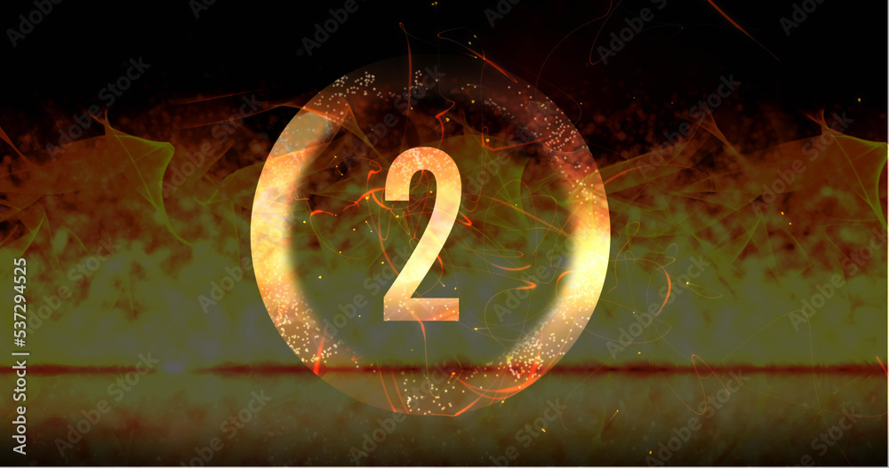 Image of ring and glowing number two in dramatic countdown over flaming ...