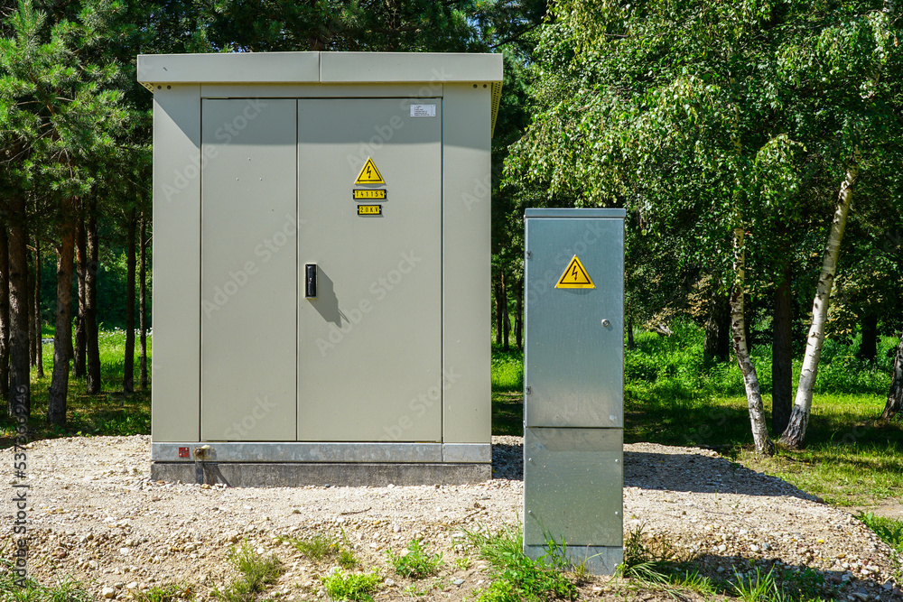 New outdoor electric high voltage distribution cabinet next to low ...