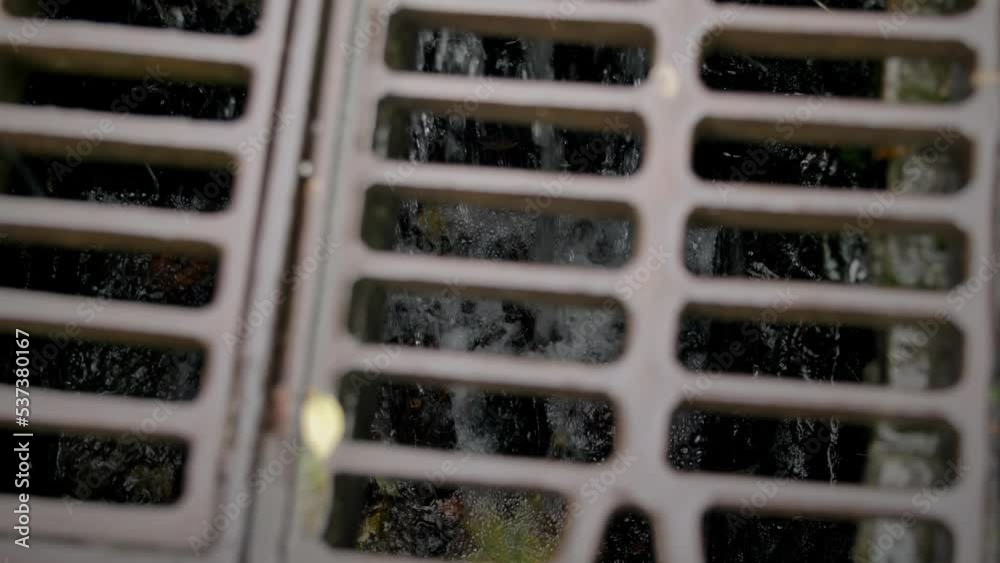 Rainwater drainage system. Rain precipitation flowing into a storm ...