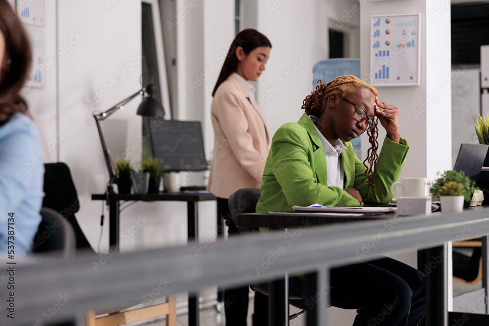 Sad employee having headache at work, touching forehead, exhausted ...