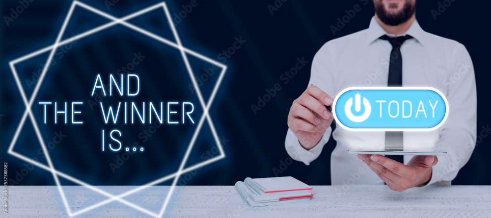 Sign displaying And The Winner Is.... Business overview Announcing who ...