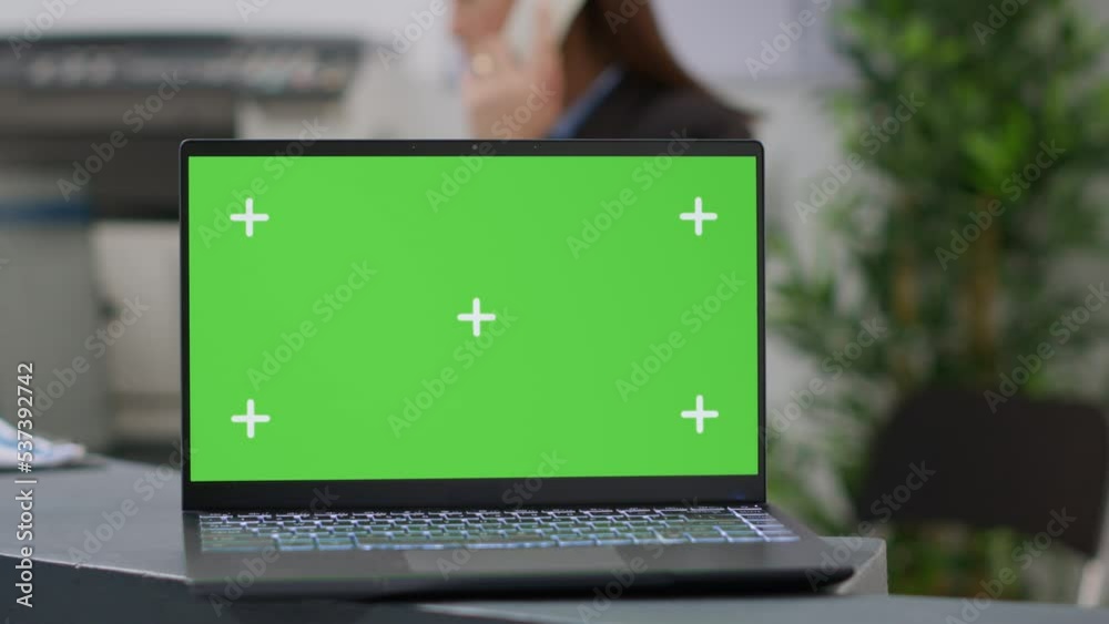 Laptop with greenscreen template at hospital reception desk used by ...