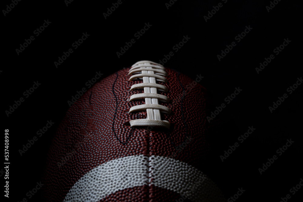 Foto de isolated white laces of football fading into black backdrop do ...