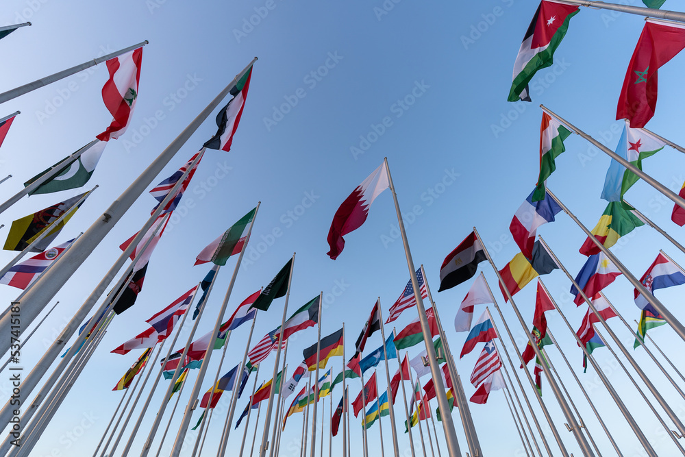 Flags of the different countries against the blue sky Stock Photo ...