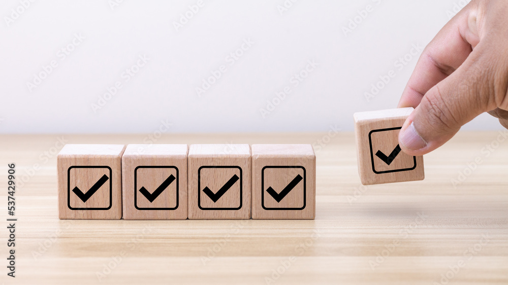 Hand holding block with tick mark, good feedback rating and positive ...