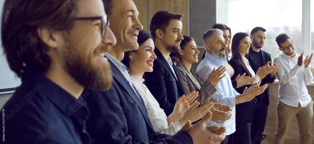 Narrow crop shot of businesspeople clap hands congratulate colleague ...