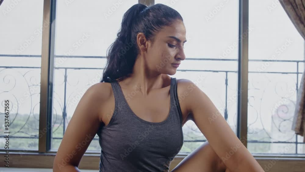 Young attractive fit Indian Asian Woman or female performing an ...