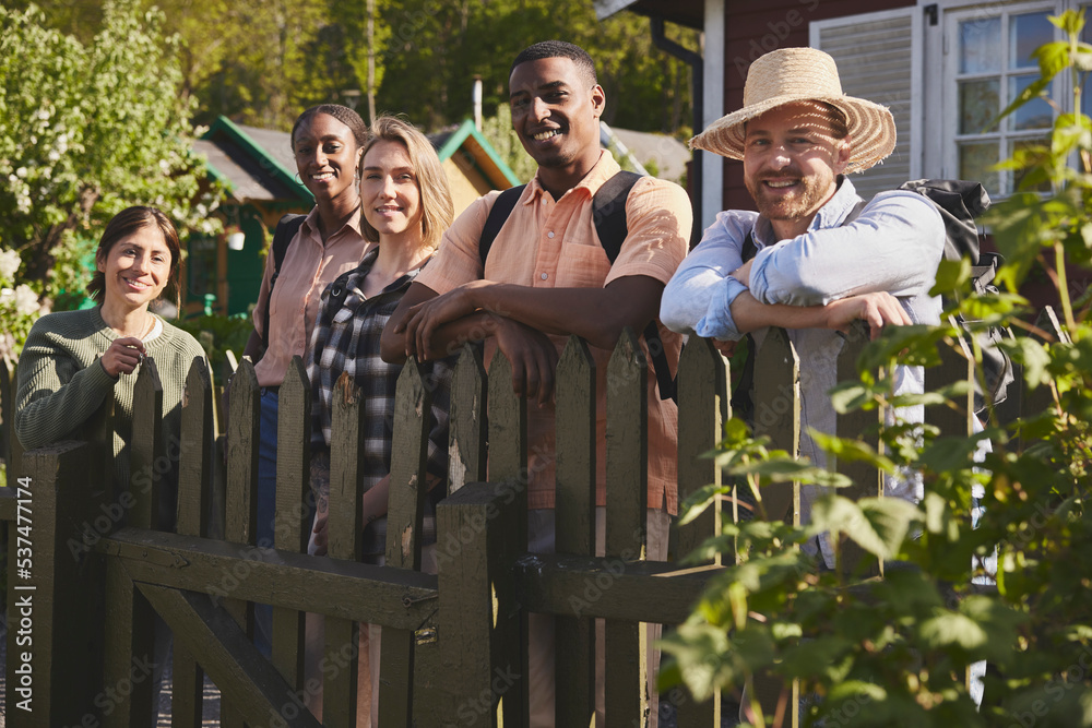 Smiling friends standing together Stock Photo | Adobe Stock