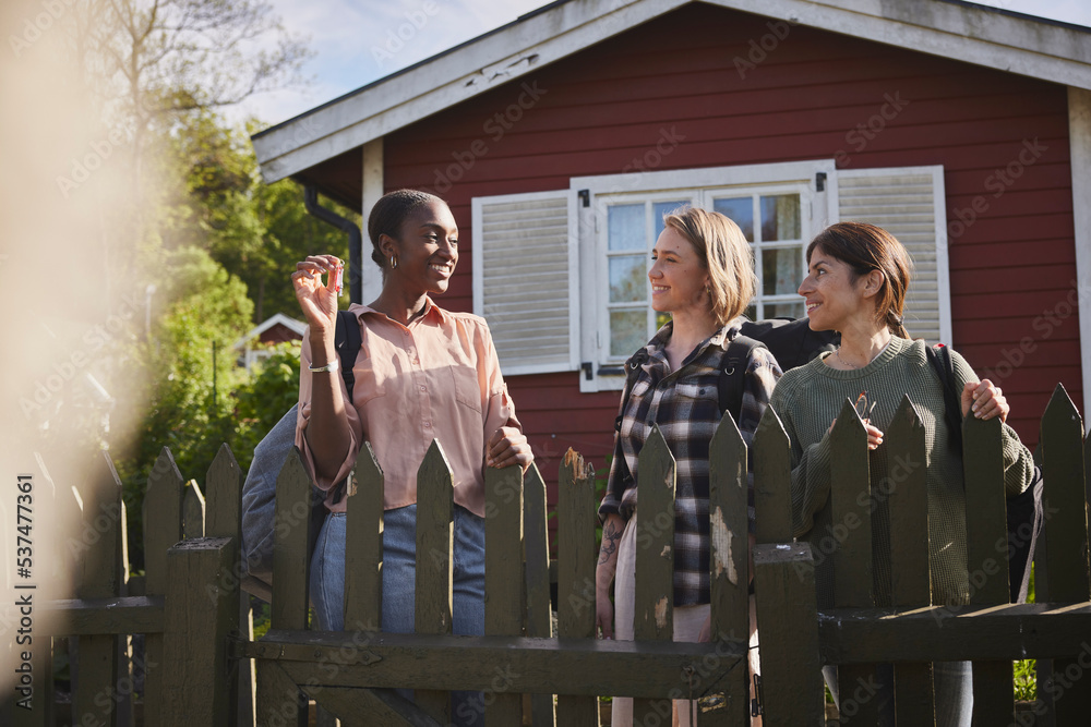 Smiling friends talking together Stock Photo | Adobe Stock