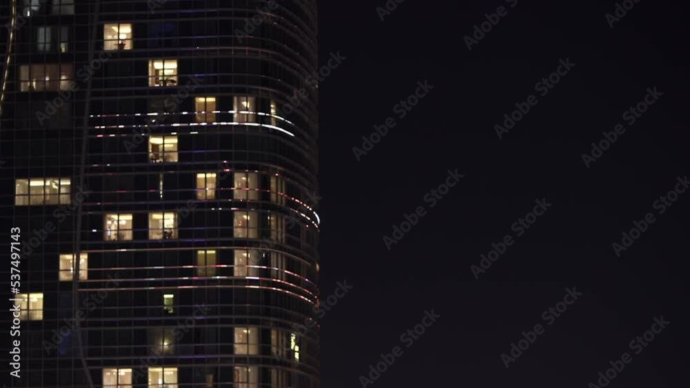 Close-up. Office building with glowing windows against the background ...