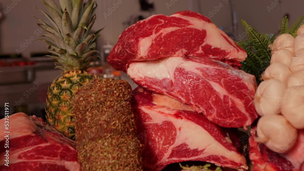 Vidéo Stock Diverse bio raised animals meat cuts and seasoned chunks at ...