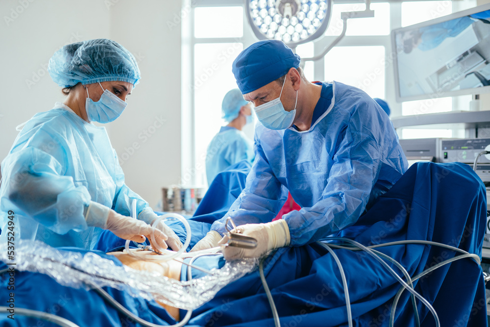 Surgeons team during preparation for surgery before performing ...