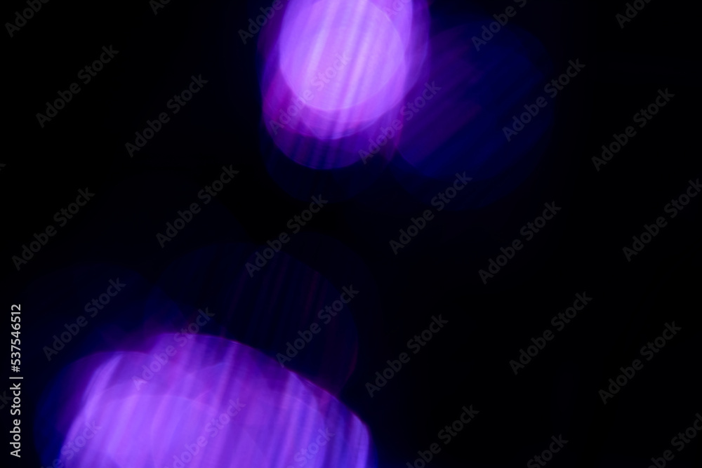 Blur purple rainbow crystal light leaks on black background. Defocused ...