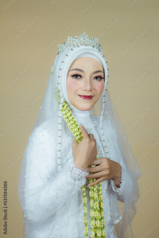 beautiful model, wearing hijab, Javanese Indonesian wedding dress in an ...