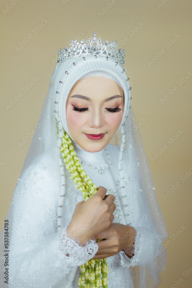 beautiful model, wearing hijab, Javanese Indonesian wedding dress in an ...