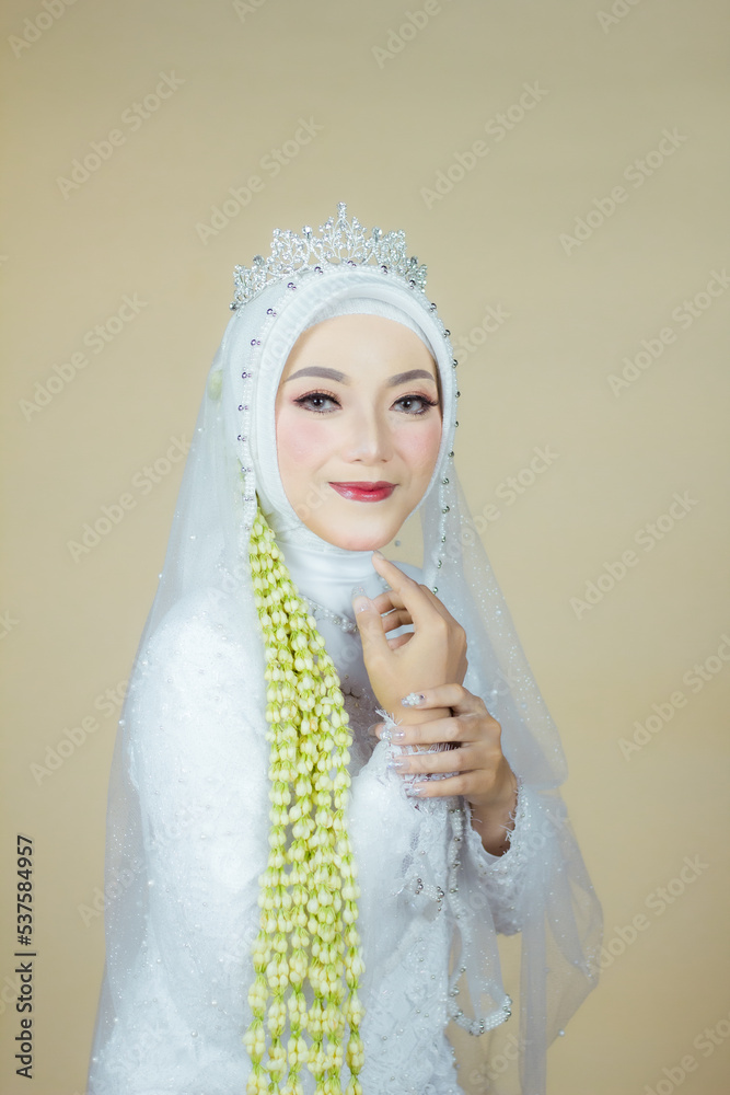 beautiful model, wearing hijab, Javanese Indonesian wedding dress in an ...