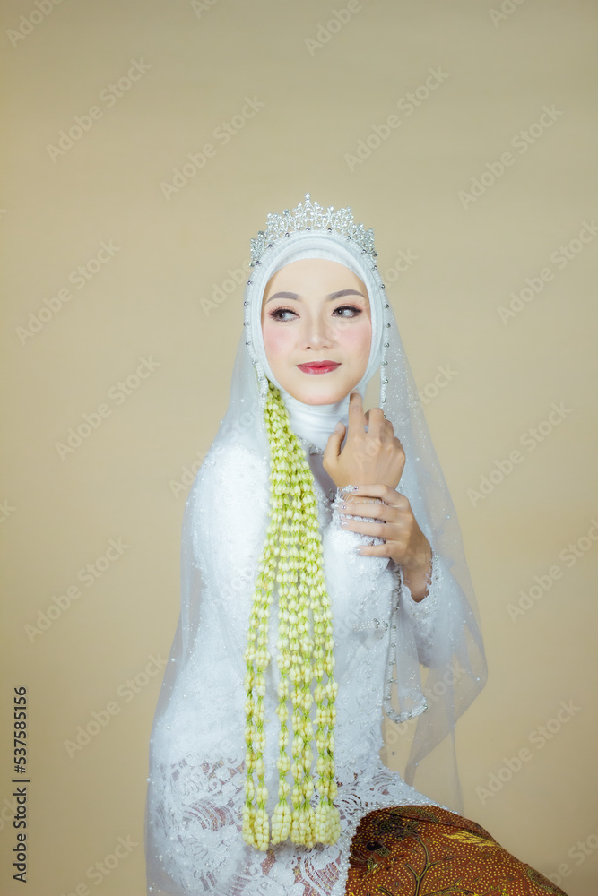 beautiful model, wearing hijab, Javanese Indonesian wedding dress in an ...