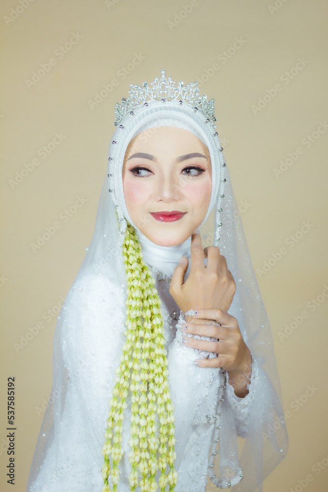 beautiful model, wearing hijab, Javanese Indonesian wedding dress in an ...