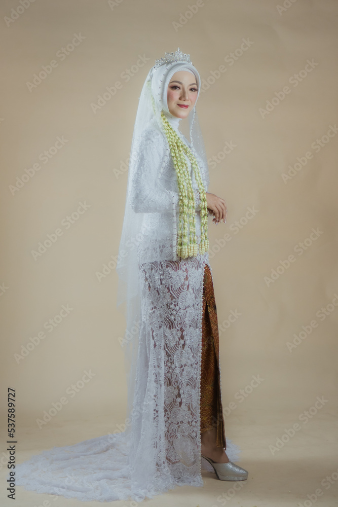 beautiful model, wearing hijab, Javanese Indonesian wedding dress in an ...
