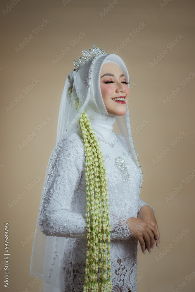 beautiful model, wearing hijab, Javanese Indonesian wedding dress in an ...