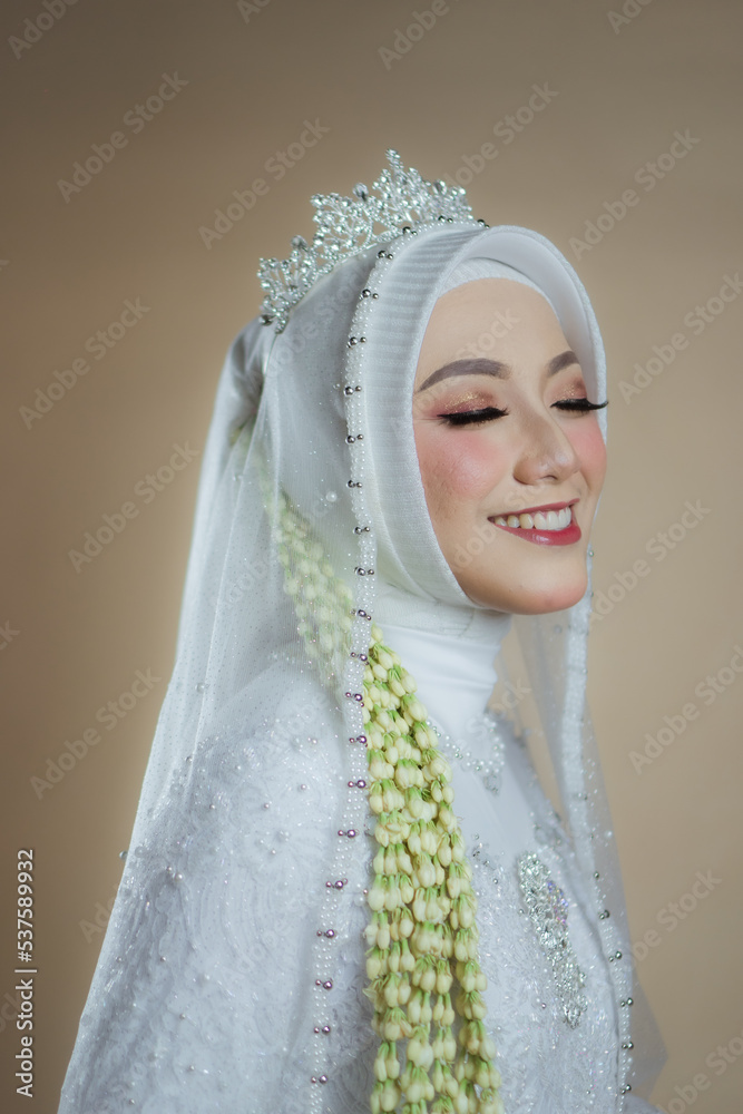 beautiful model, wearing hijab, Javanese Indonesian wedding dress in an ...