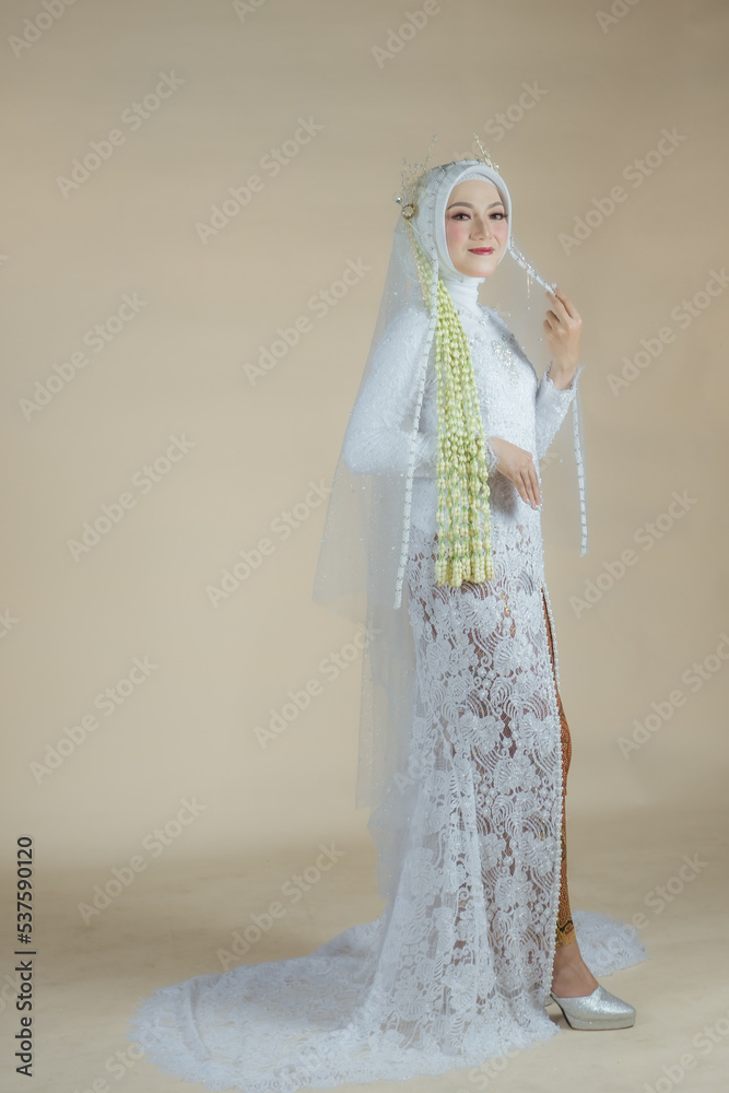 beautiful model, wearing hijab, Javanese Indonesian wedding dress in an ...