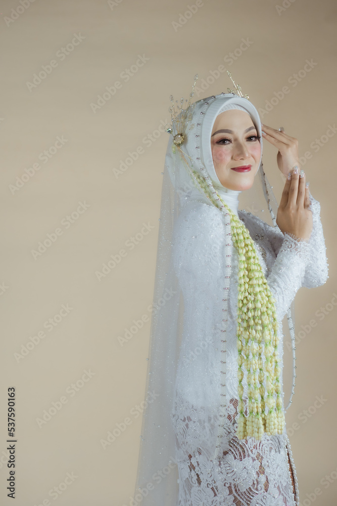 beautiful model, wearing hijab, Javanese Indonesian wedding dress in an ...