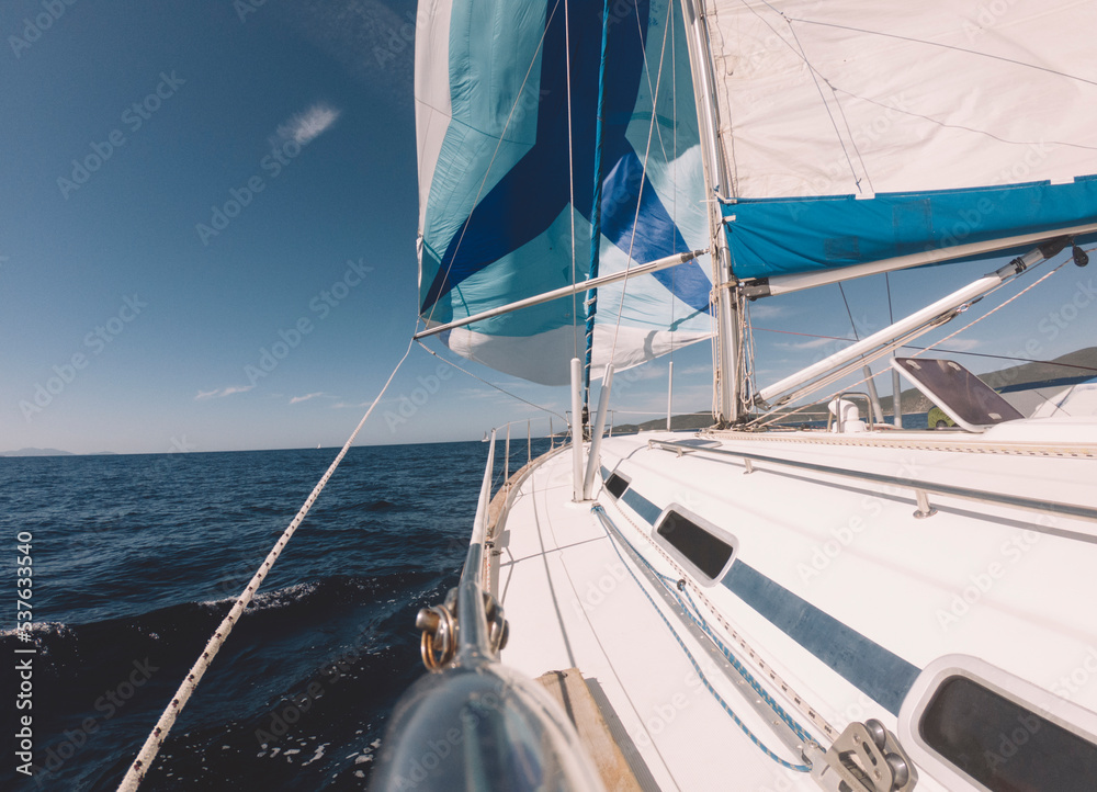 Sailboat with spinnaker sail opened Stock Photo | Adobe Stock
