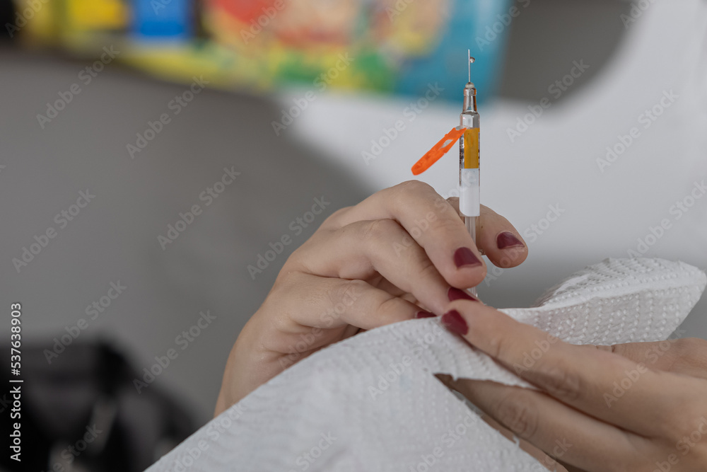 Female or young woman preparing anticoagulation shot against blood ...