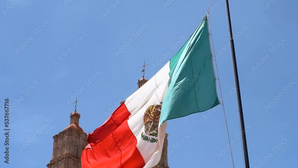 Mexican flag waving with Parroquia Cathedral Dolores Hidalgo Mexico ...