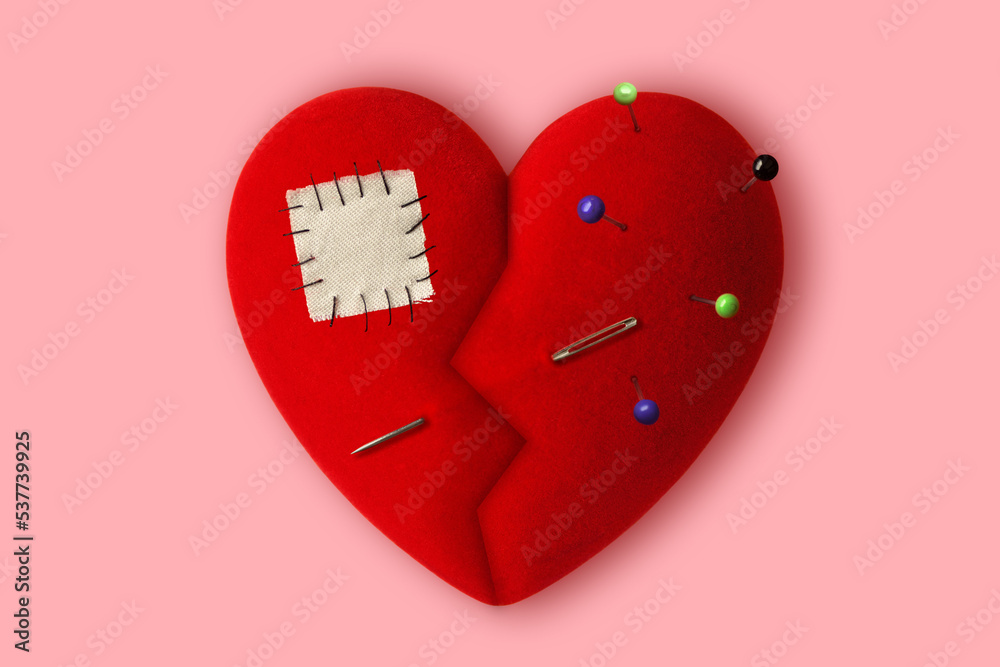 Broken heart with pins, sewing needle and patch on pink background ...