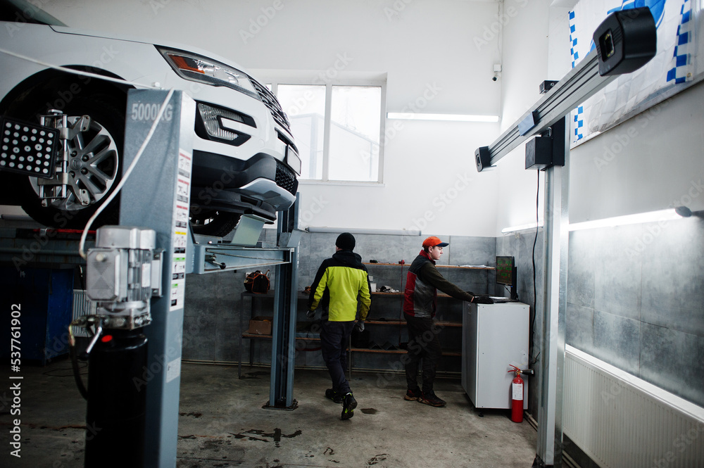 Auto mechanic sets american SUV car for diagnostics and configuration ...