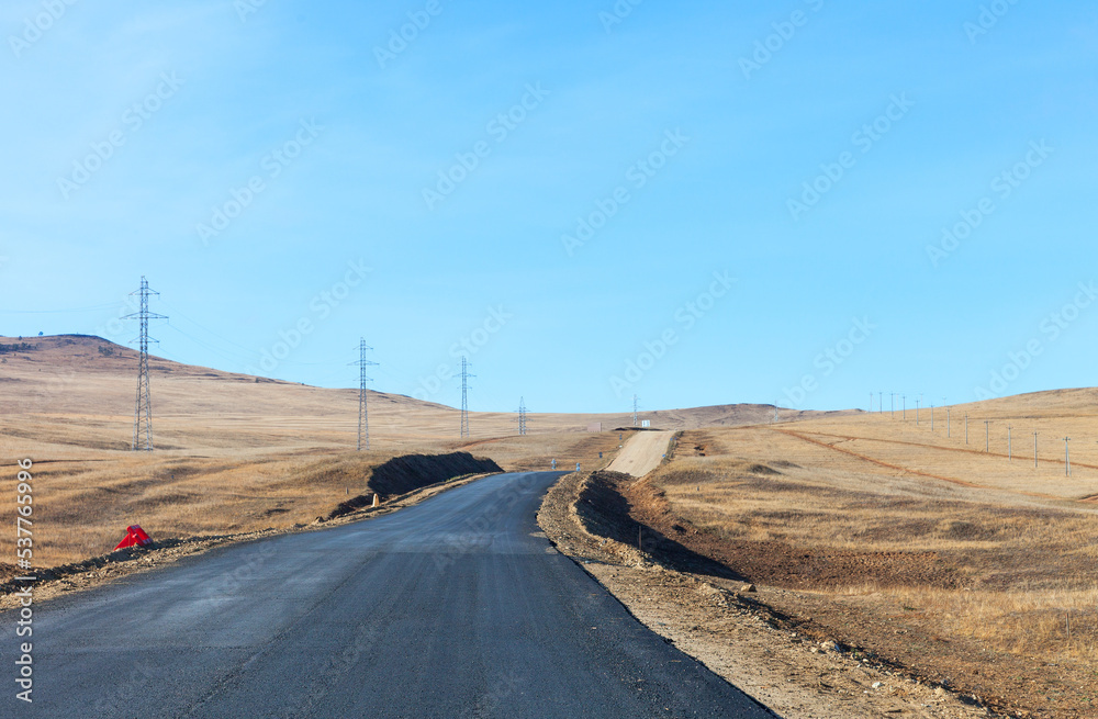 Baikal. Olkhon Island. The first meters of asphalt pavement from the ...
