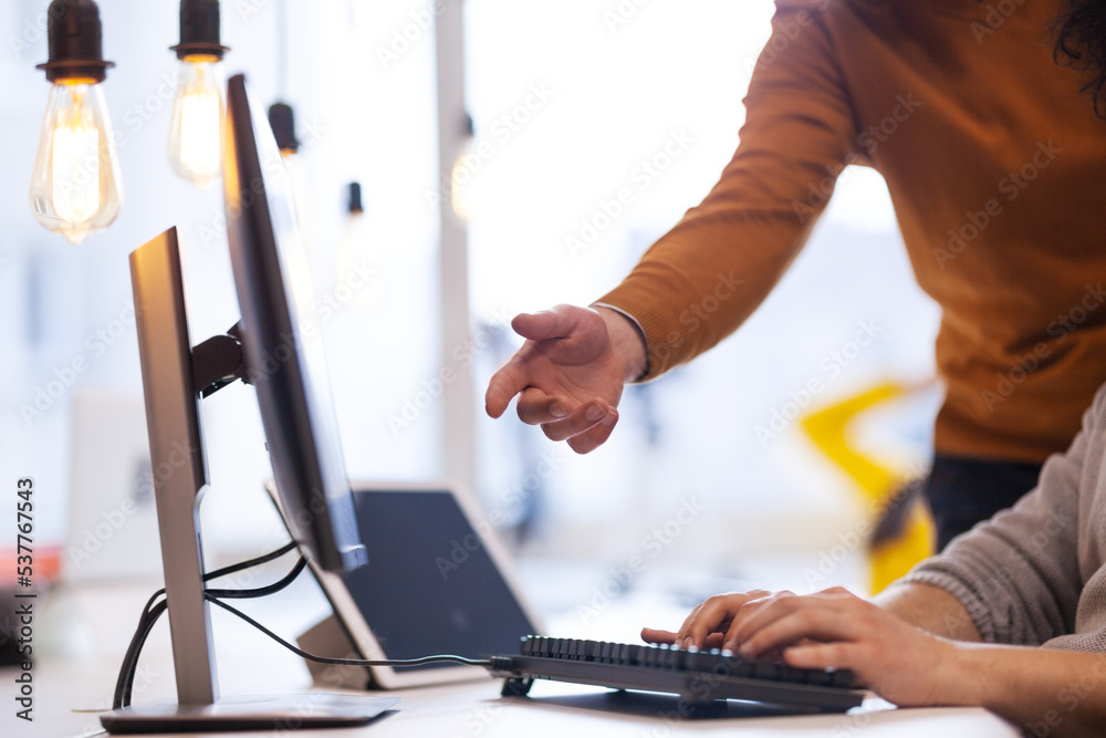 Business people having conversation in modern coworking office space ...