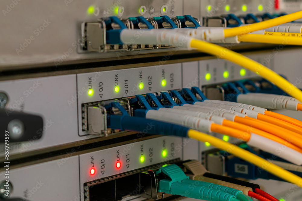Fiber optic telecommunication cables are connected to the interfaces of ...