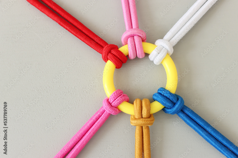 Concept image of unity and teamwork. Ropes tied together as a symbol of ...