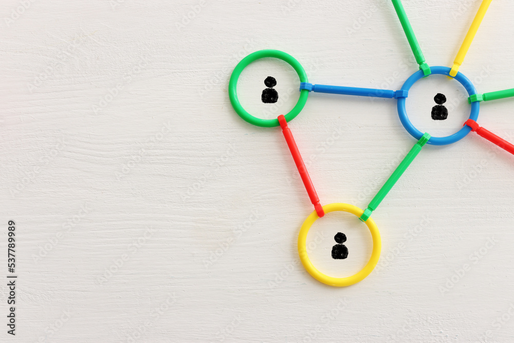 Concept image of unity and teamwork. People icons tied together as a ...