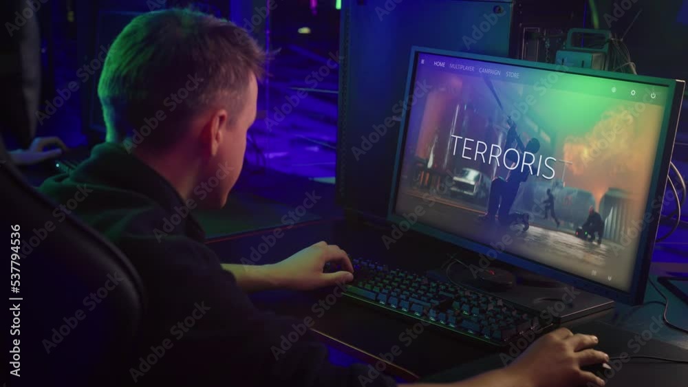 Gamer playing the modern shooter computer game. Gamer pressing a ...