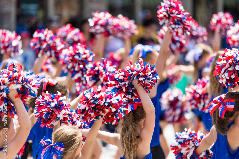Cheerleaders Holding Red White And Blue Pom Poms At Fourth Of July