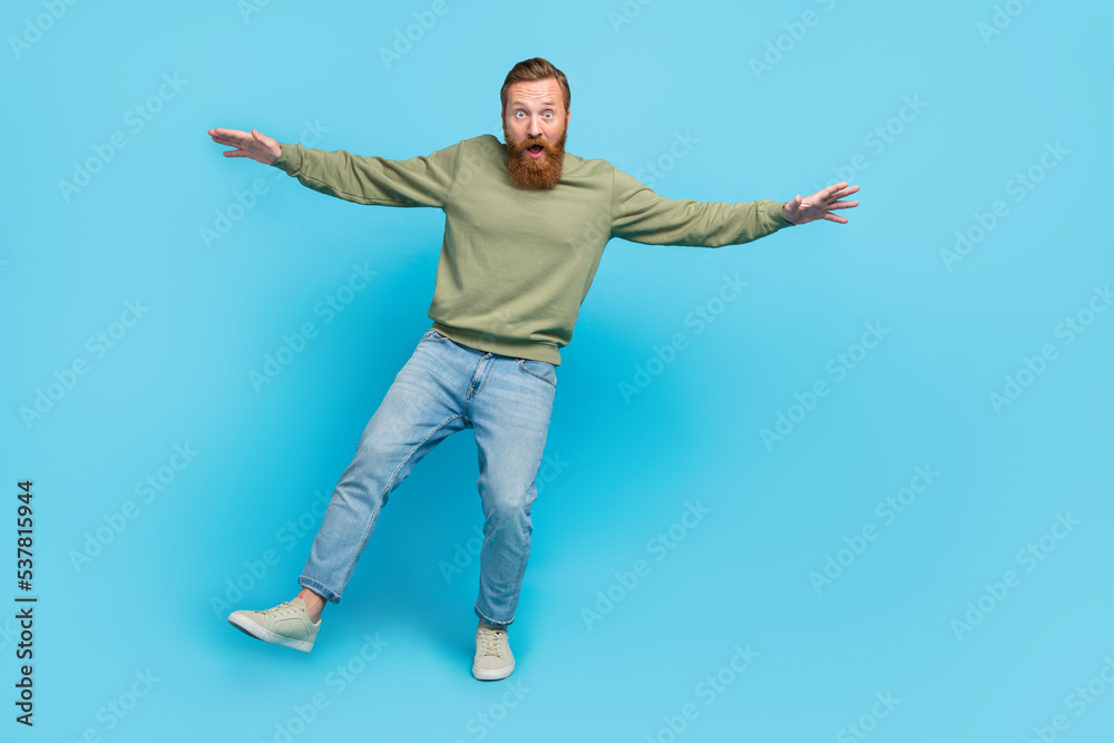 Full size photo of nice young guy balancing one leg falling scared ...