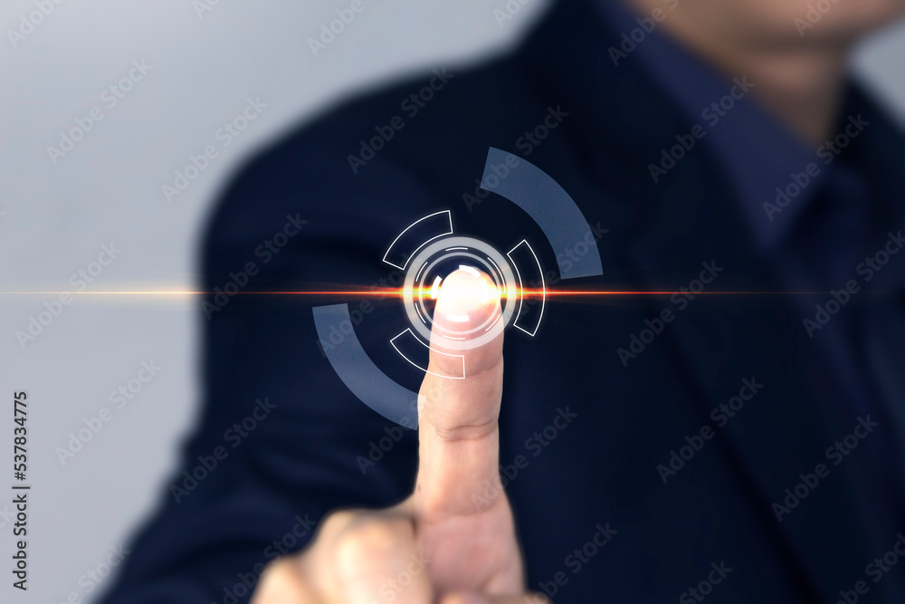 Businessman touches on LIGHT Flar of technology screen, a man finger ...