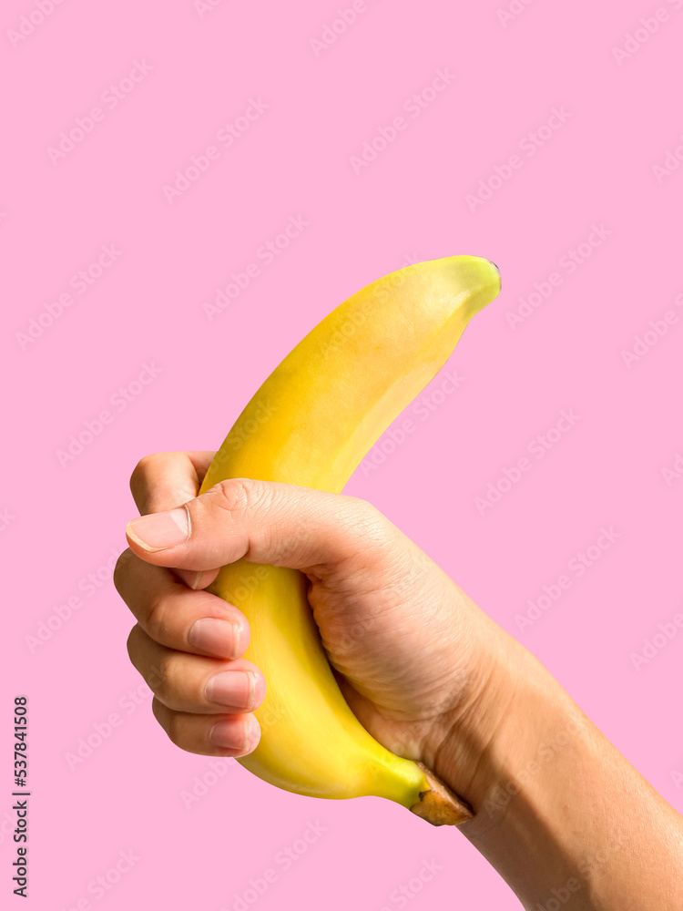 hand holding a beautiful, fresh, yellow banana. Isolated on white ...