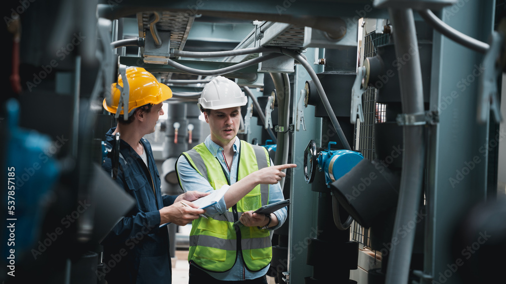 Engineer and team examining the air conditioning cooling system of a ...