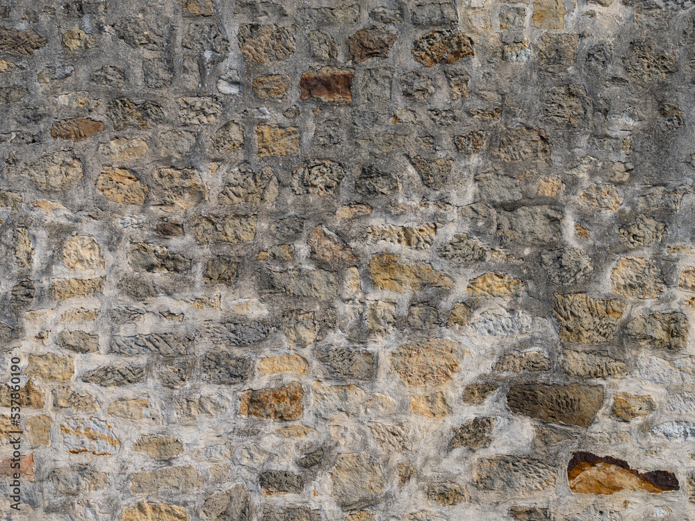 Old stone wall texture with different natural stones. Abstract ...