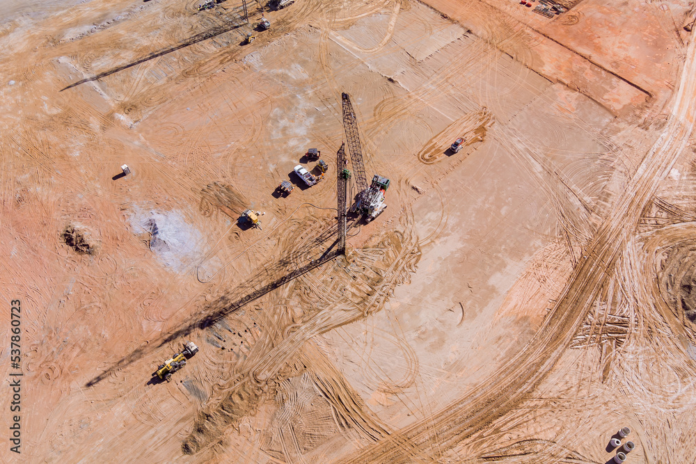 Construction site truck mounted pump pumping concrete sweat earth under ...